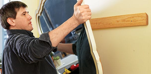 How To Hang Something Heavy On a Wall - This Old House